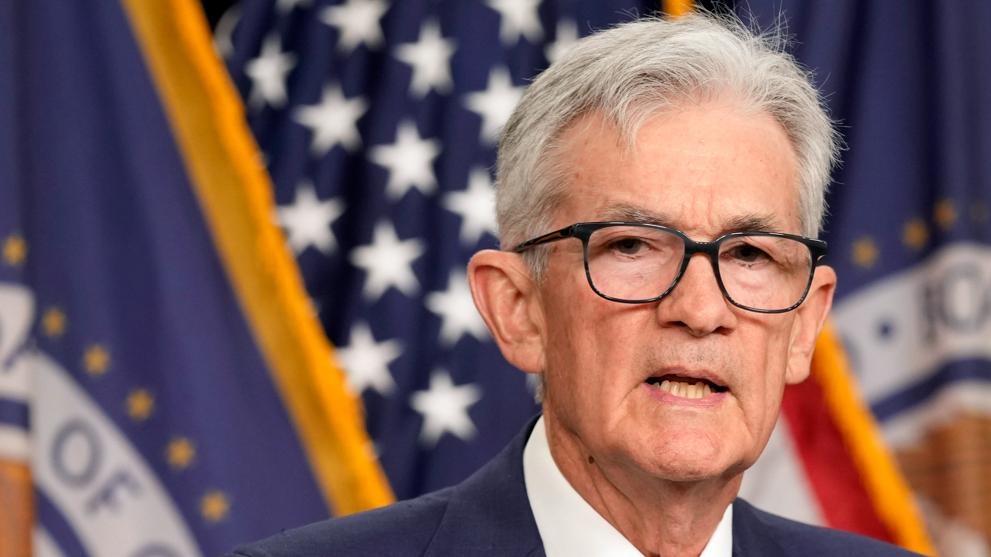 Fed holds rates steady, flags 'lack of further progress' on inflation