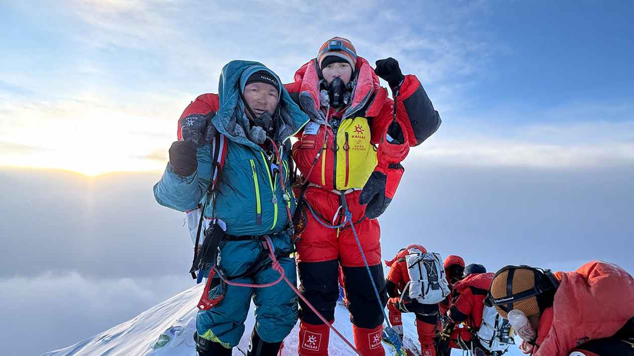 Young climber finds 'pure happiness' at top of world