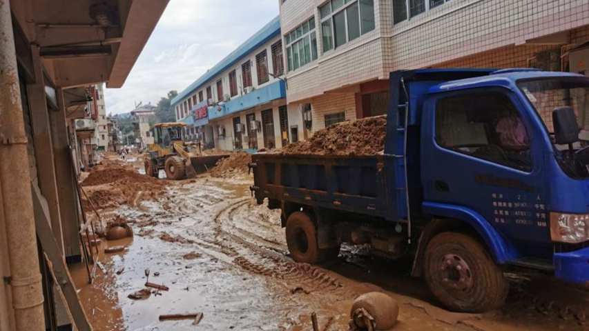 Search goes on for victims of floods, collapsed buildings