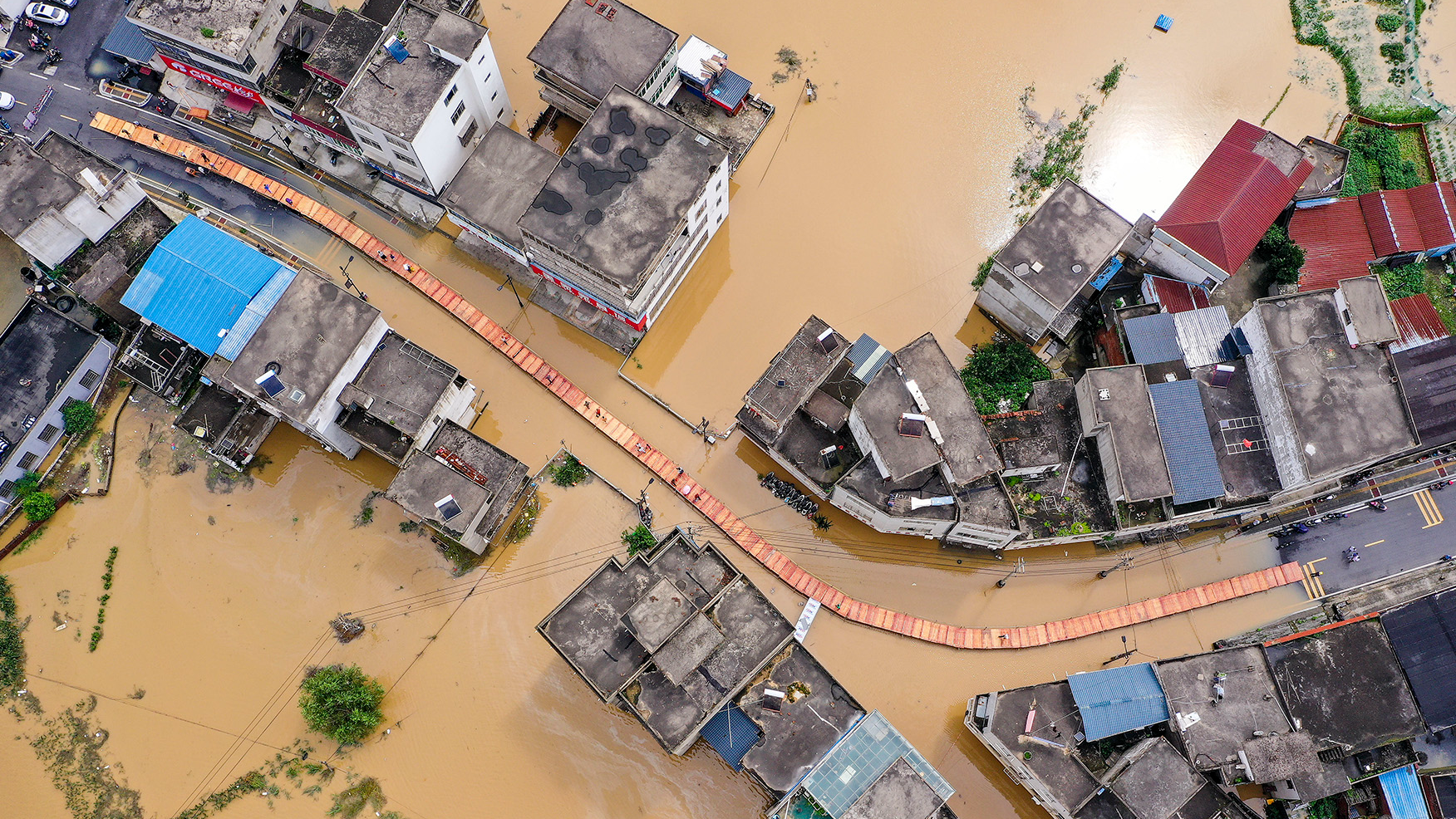 Town besieged by floodwaters is calling for reinforcements