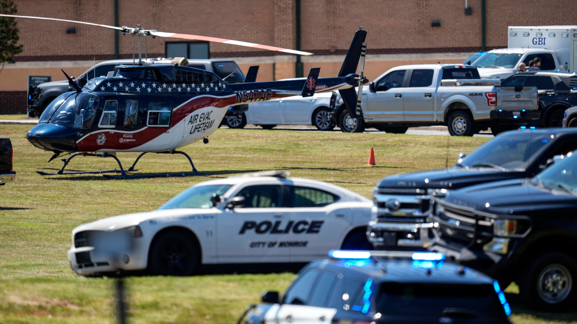 Georgia high school student, 14, kills 4 and wounds 9 in campus shooting
