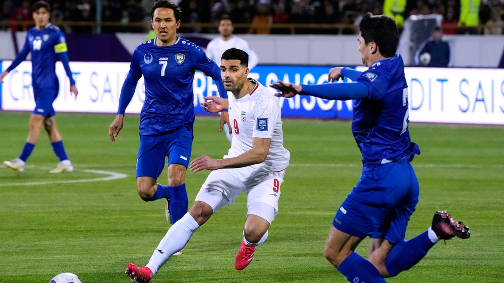 Iran seal World Cup qualification as Taremi double earns draw