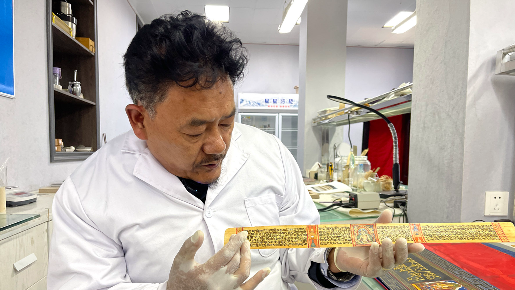 Palm-leaf scripture experts seek to master restoration