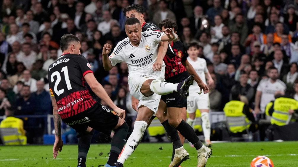 Real Madrid fight back to beat Mallorca and put Barca party on hold