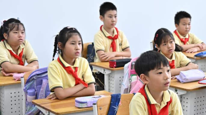 China further eases students' academic burden